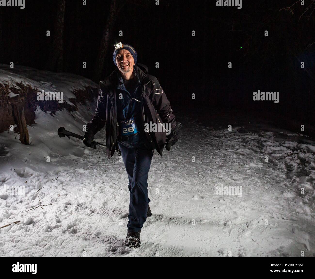 ALMATY KAZAKHSTAN: FEBRUARY 15, 2020: Unidentified people run at winer ...