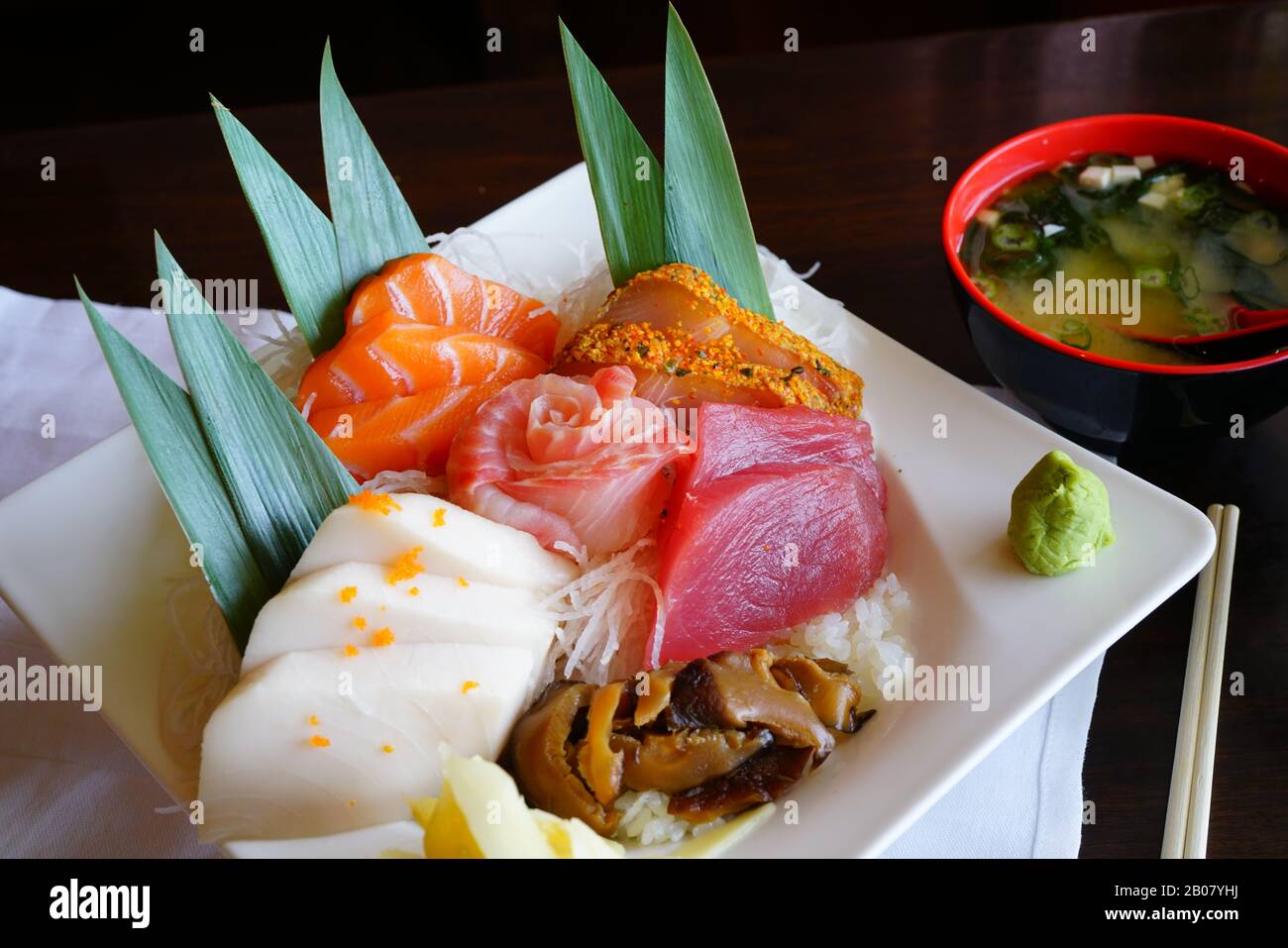 A plate of raw fish chirashi at a Japanese restaurant Stock Photo - Alamy