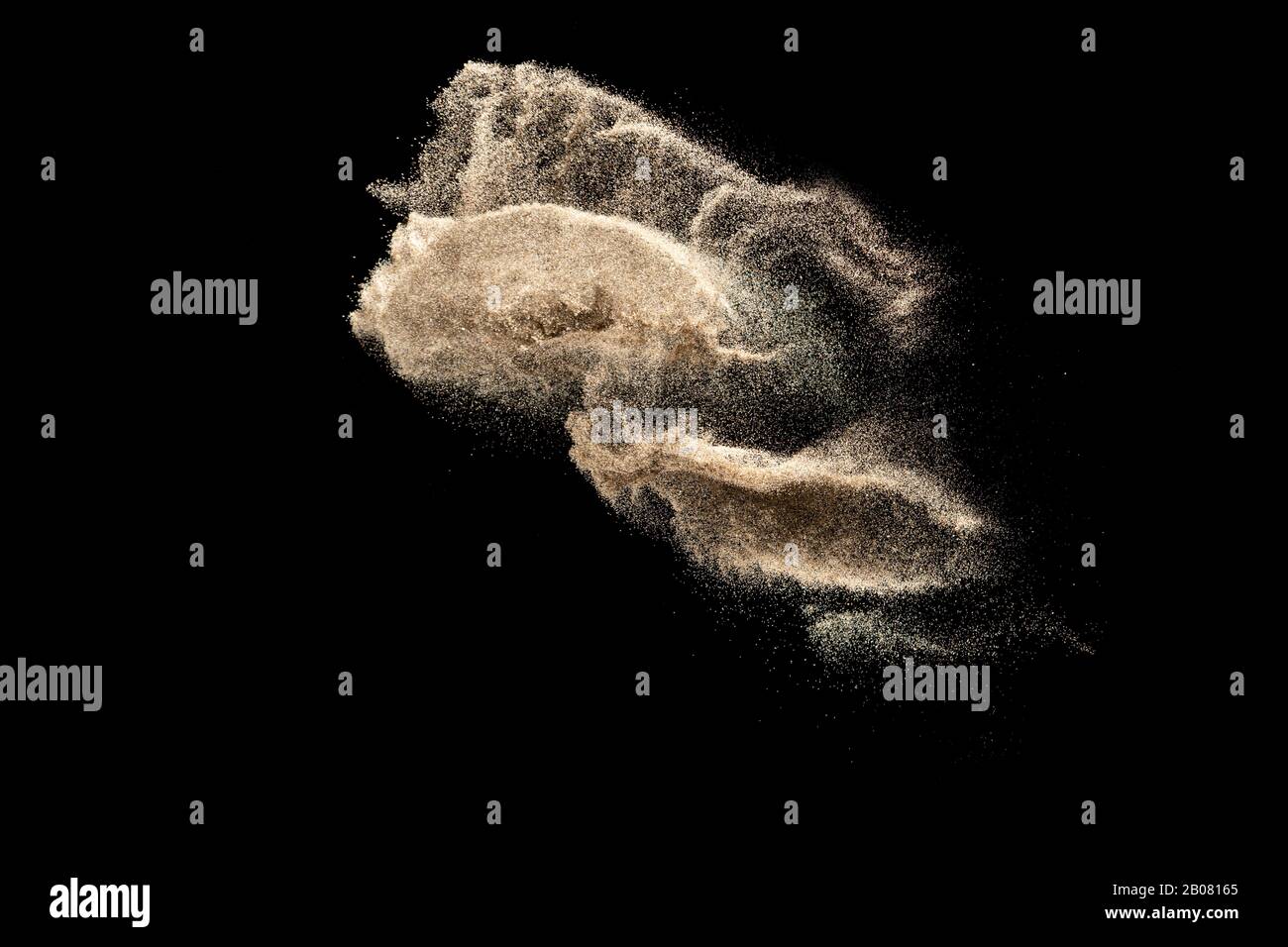 Brown colored sand splash.Dry river sand explosion isolated on black ...