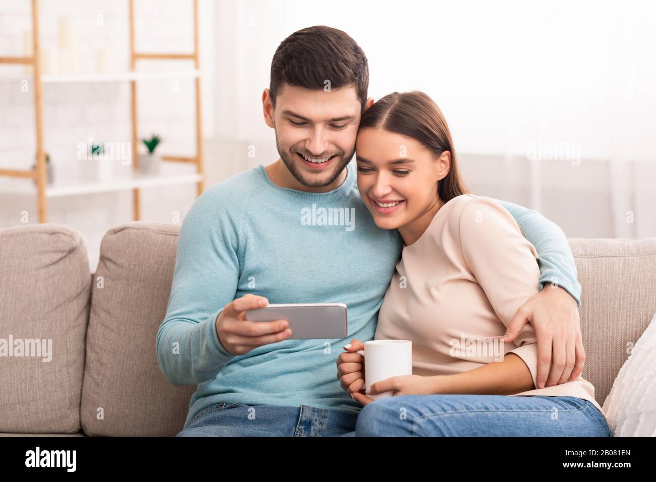 Mobile hugging hi-res stock photography and images - Alamy