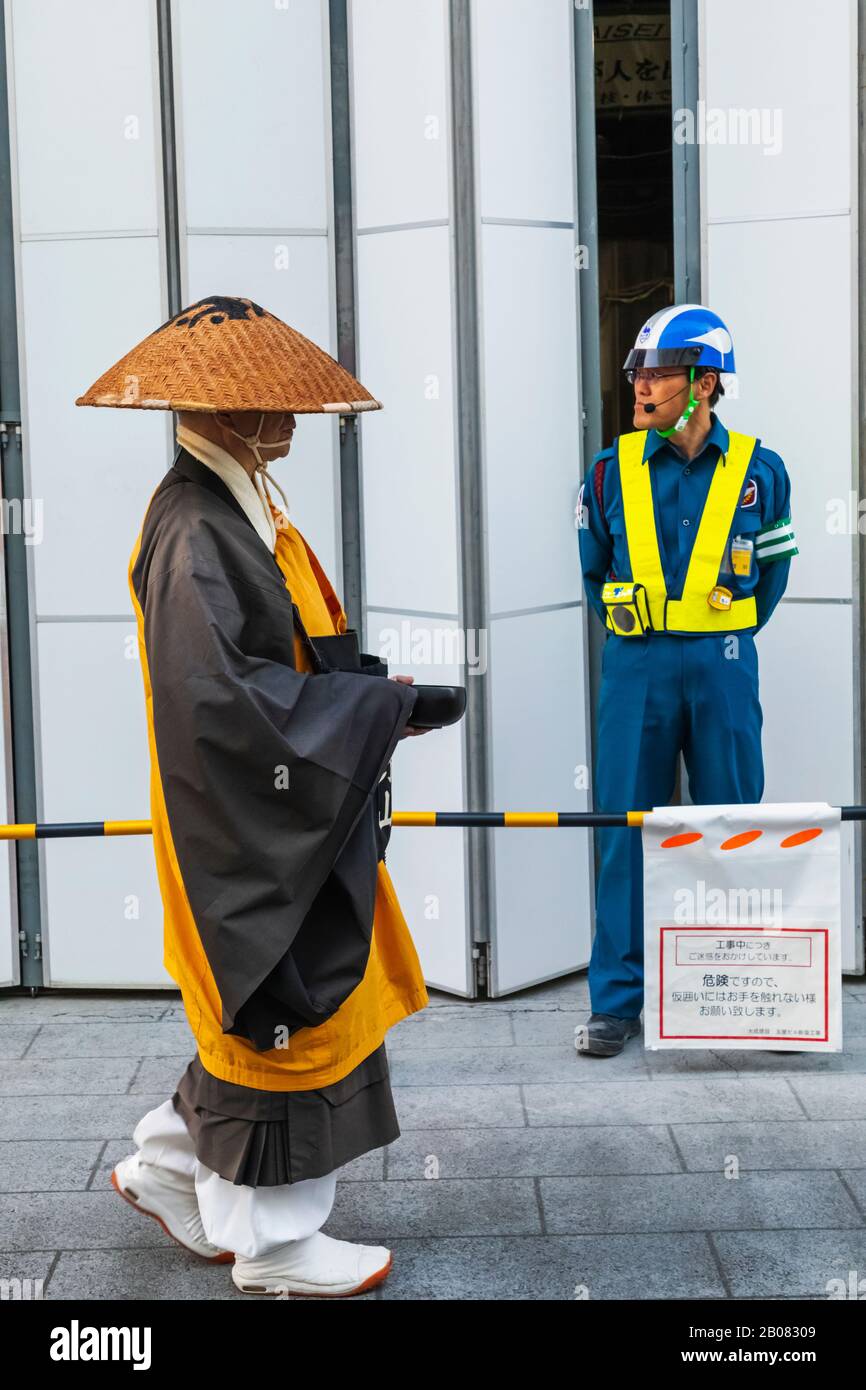 Japan, Honshu, Tokyo, Ginza, Chuo-dori Shopping Street, Monk Walking ...