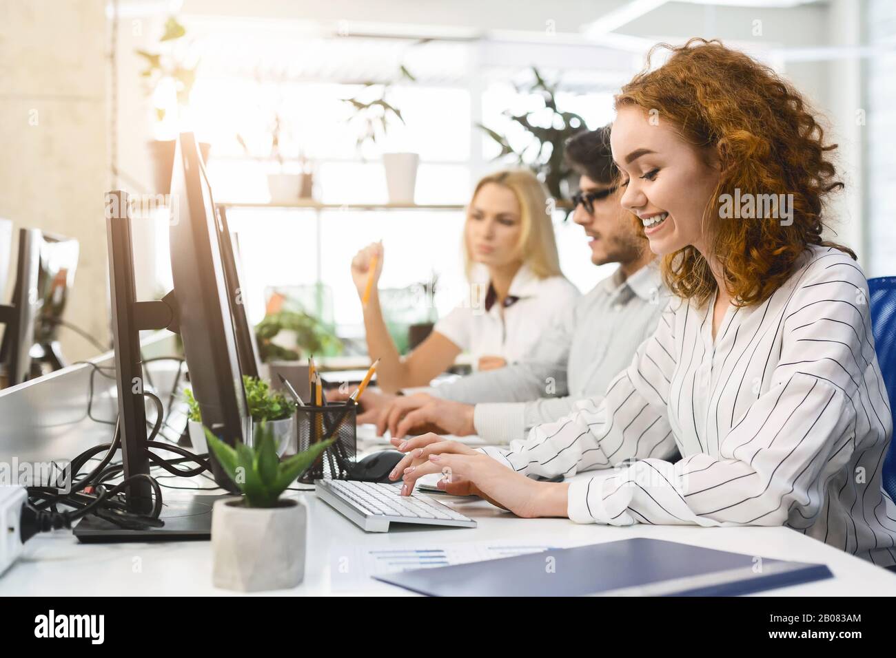 Network computers office colleagues hi-res stock photography and images ...