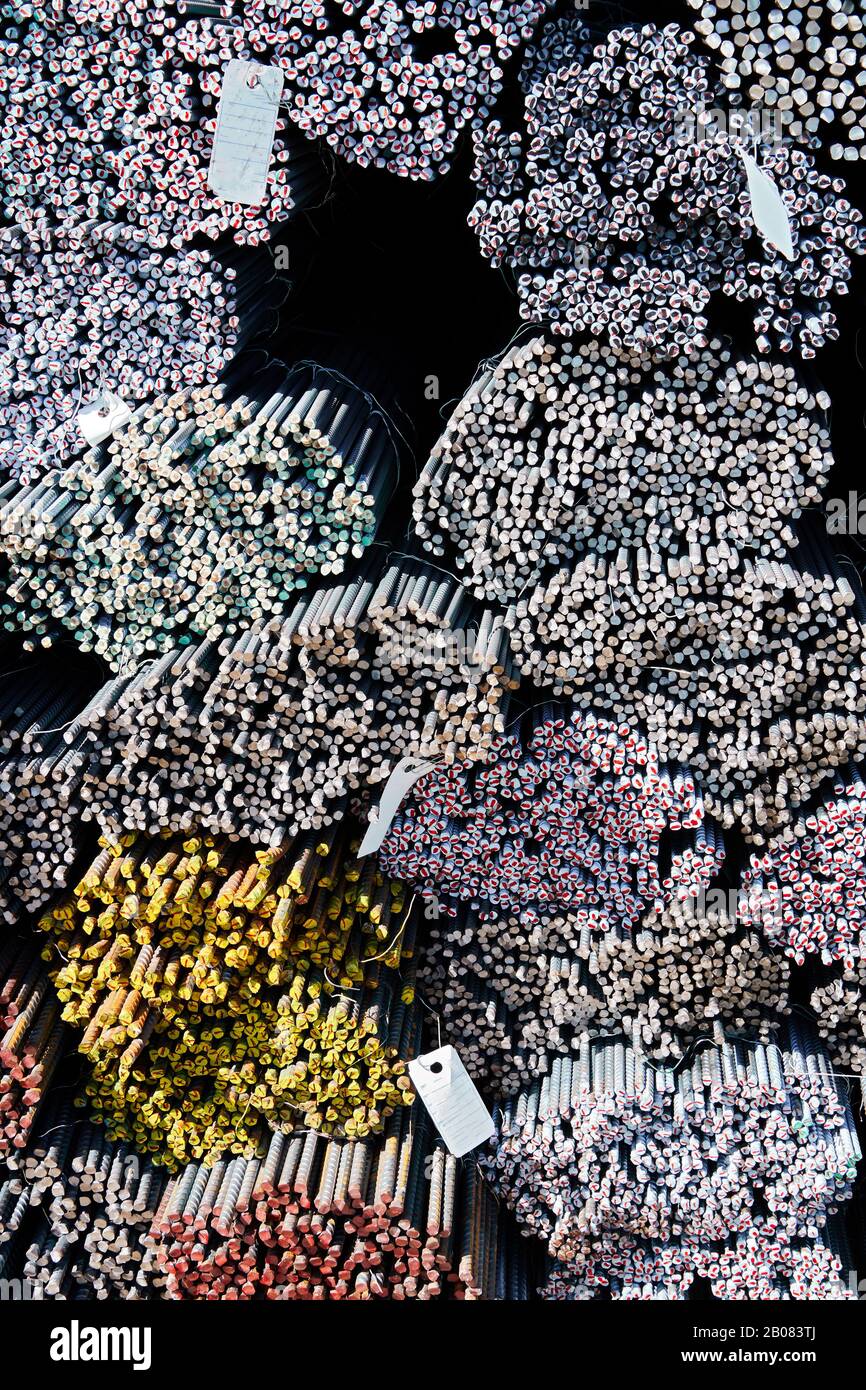Close-up of piles of steel bars, marked on its end with different ...