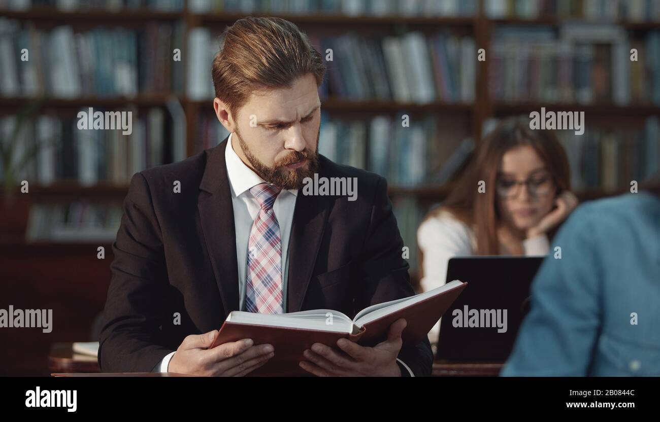 Focused businessman sitting table hi-res stock photography and images ...