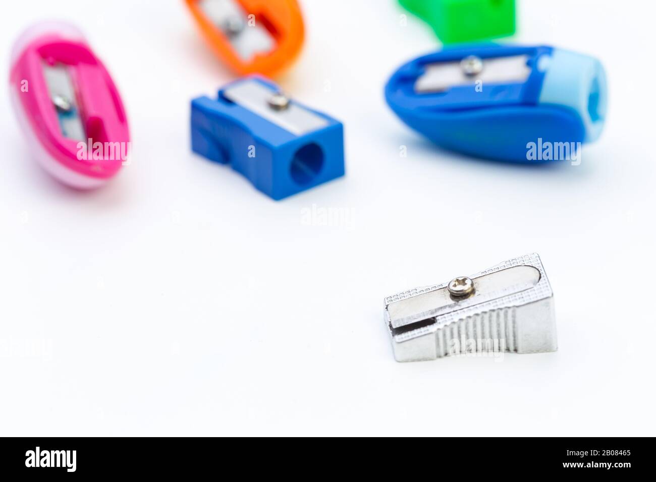 different colors sharpener isolated on white background Stock Photo - Alamy