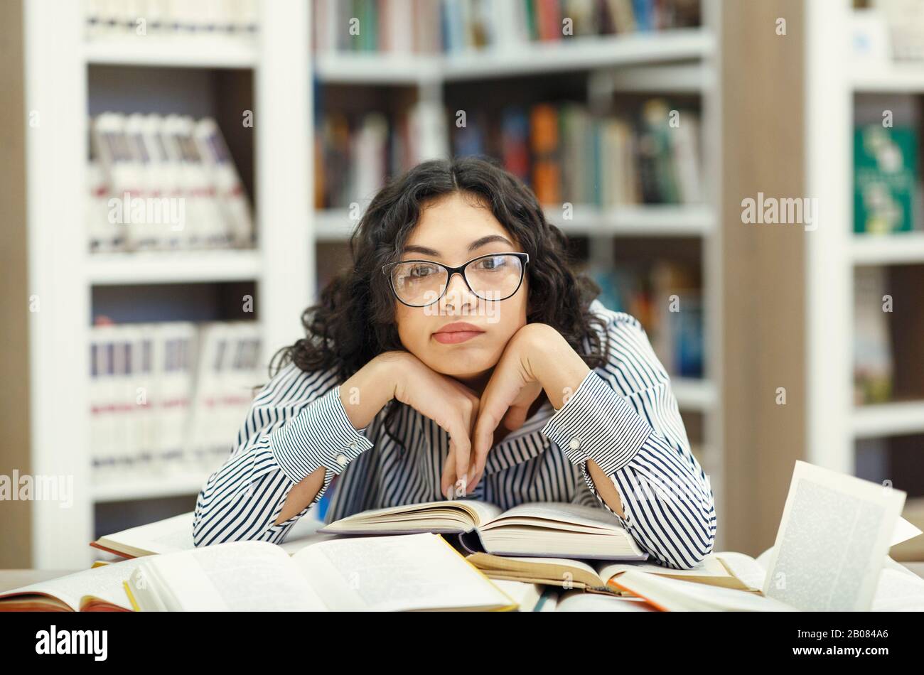Tired students napping in the campus library Stock Photo - Alamy