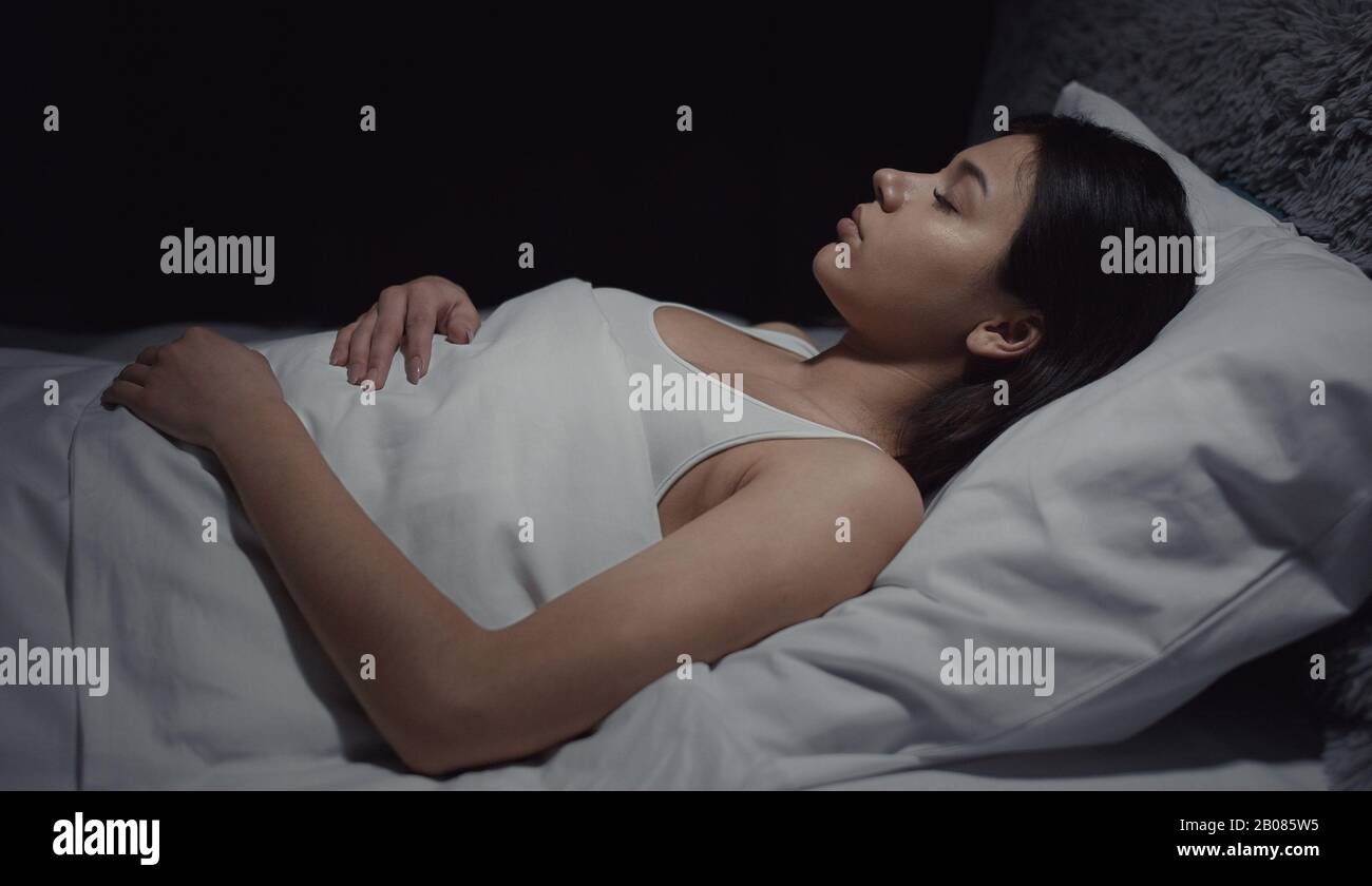 Side view of sleeping brunette Stock Photo - Alamy