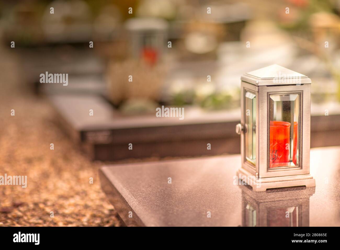 burning candle on a grave Stock Photo - Alamy