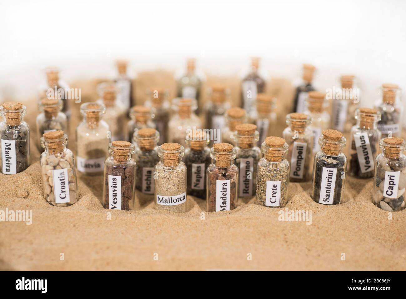 Glass test-tube with sand of different summer vacation countries Stock ...