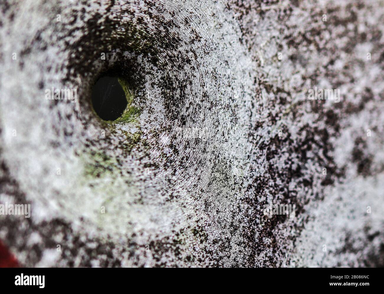 Detailed close up view on bullet holes of gunshots at a traffic sign ...