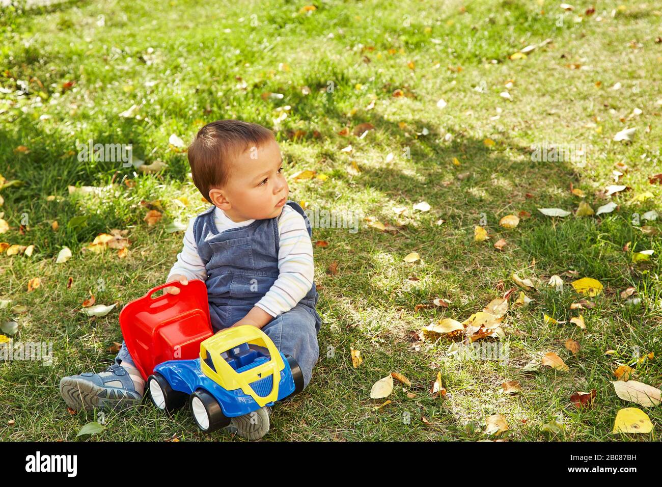 little boy playing with a toy truck Stock Photo - Alamy