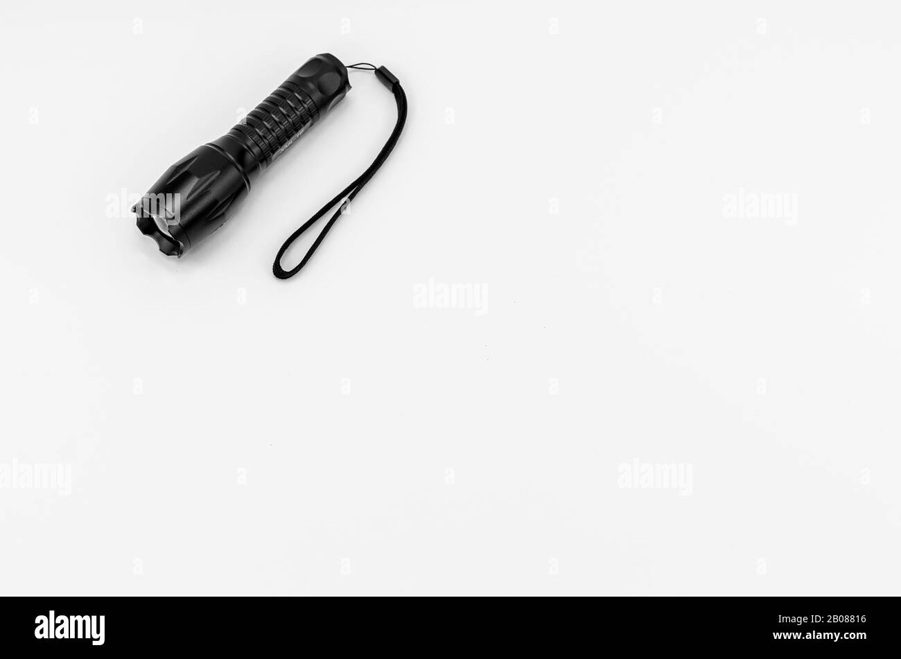 mini LED flashlight with black metallic body Stock Photo - Alamy