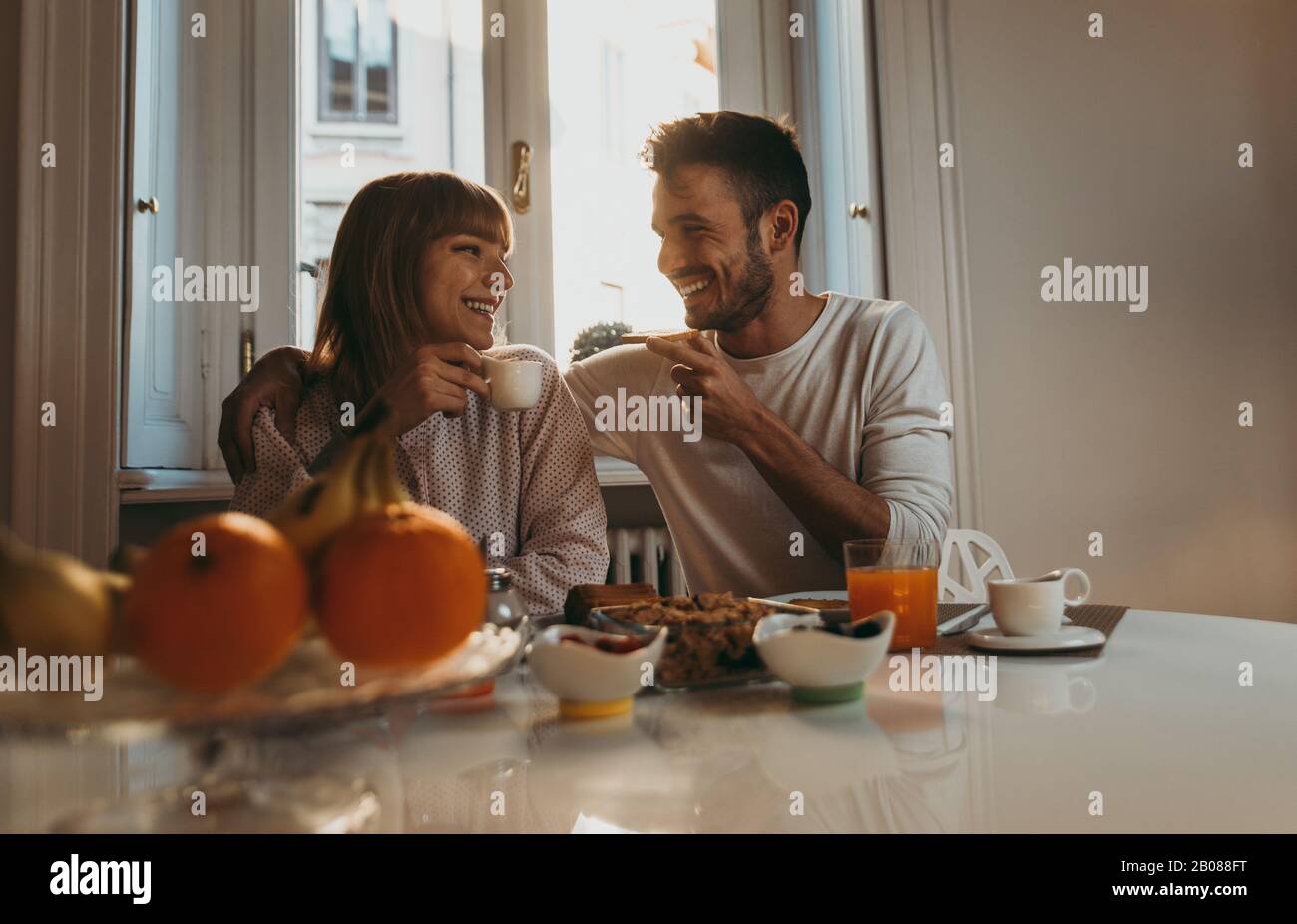 Happy couple making breakfast at home. Concept about lifestyle, healthy ...