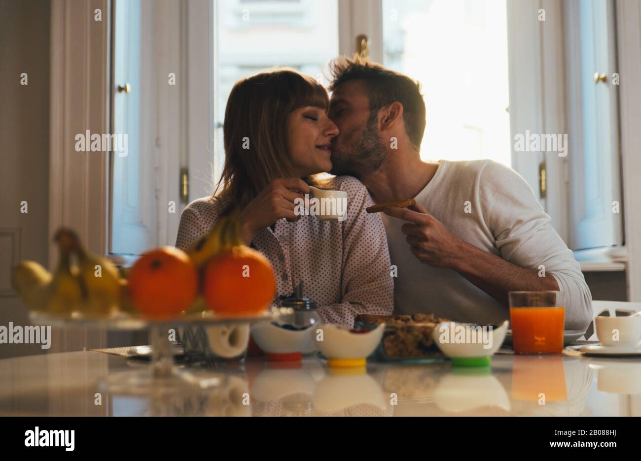 Happy couple making breakfast at home. Concept about lifestyle, healthy ...