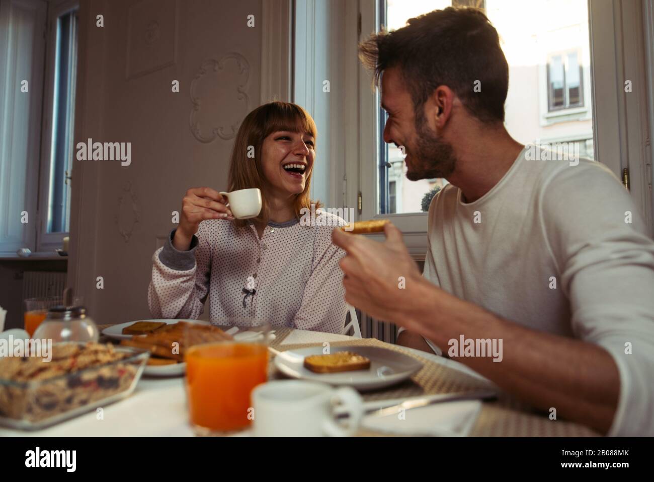 Happy couple making breakfast at home. Concept about lifestyle, healthy ...
