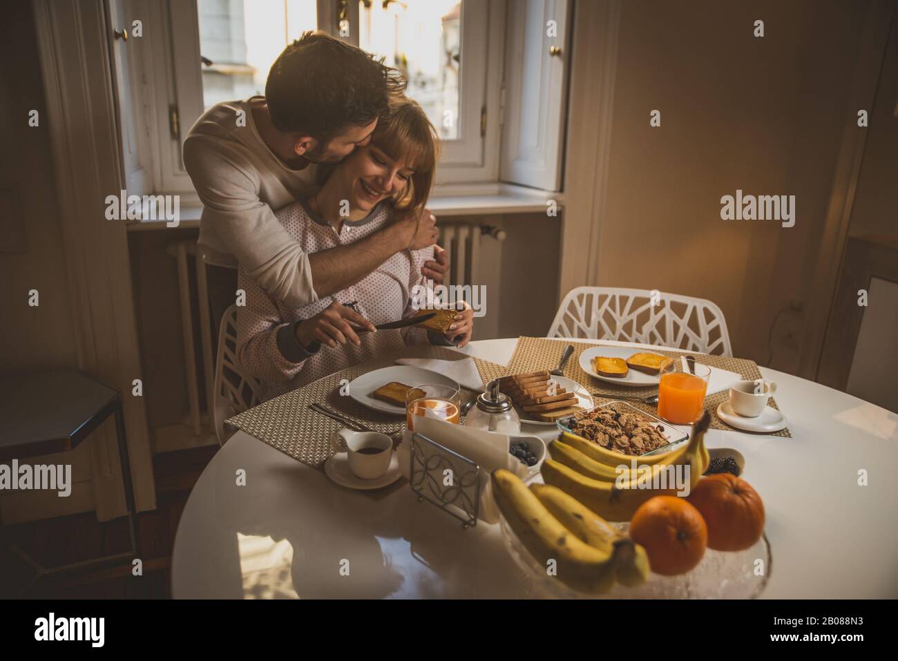 Happy couple making breakfast at home. Concept about lifestyle, healthy ...