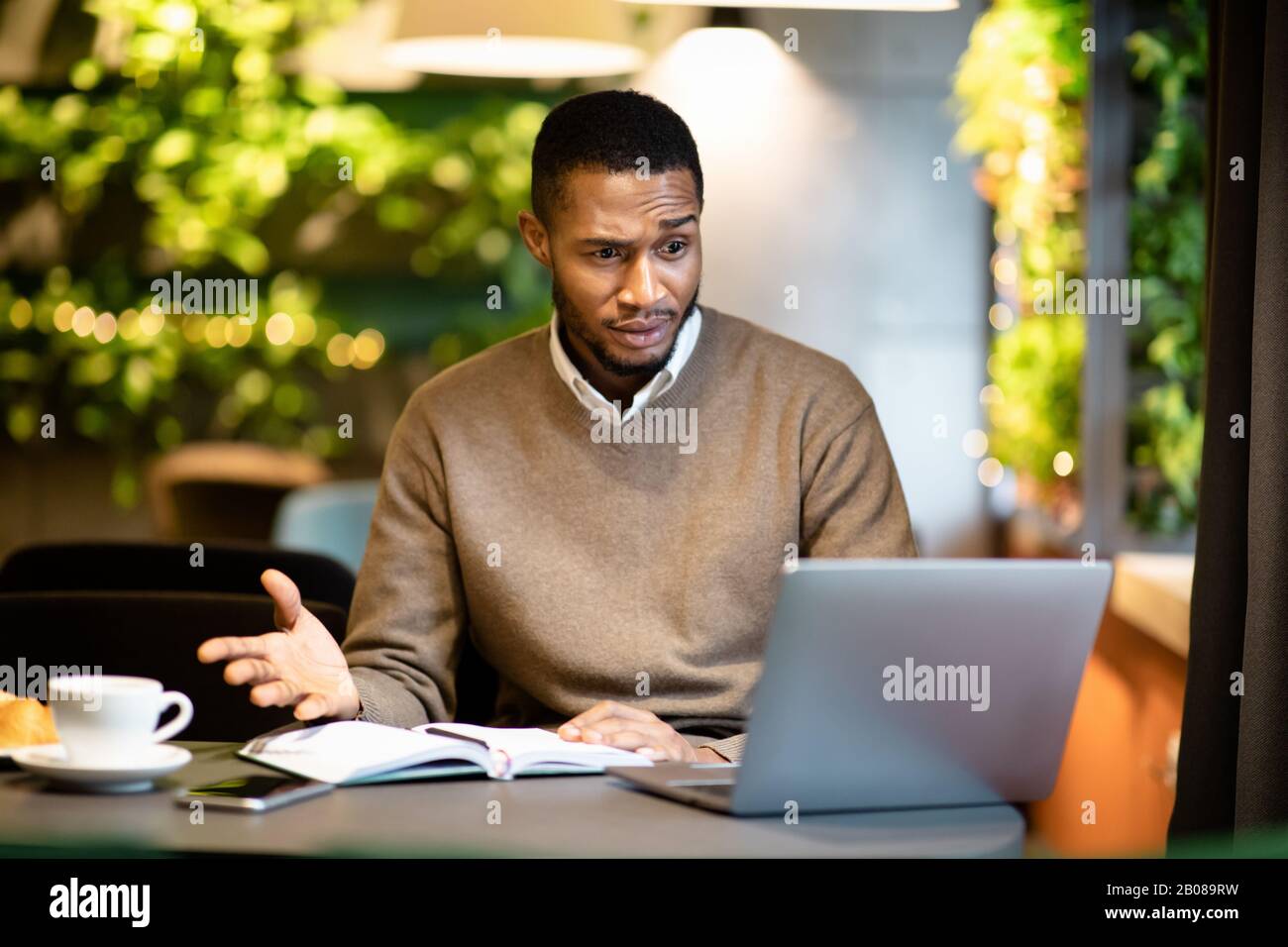 Confused young african hipster man hi-res stock photography and images ...