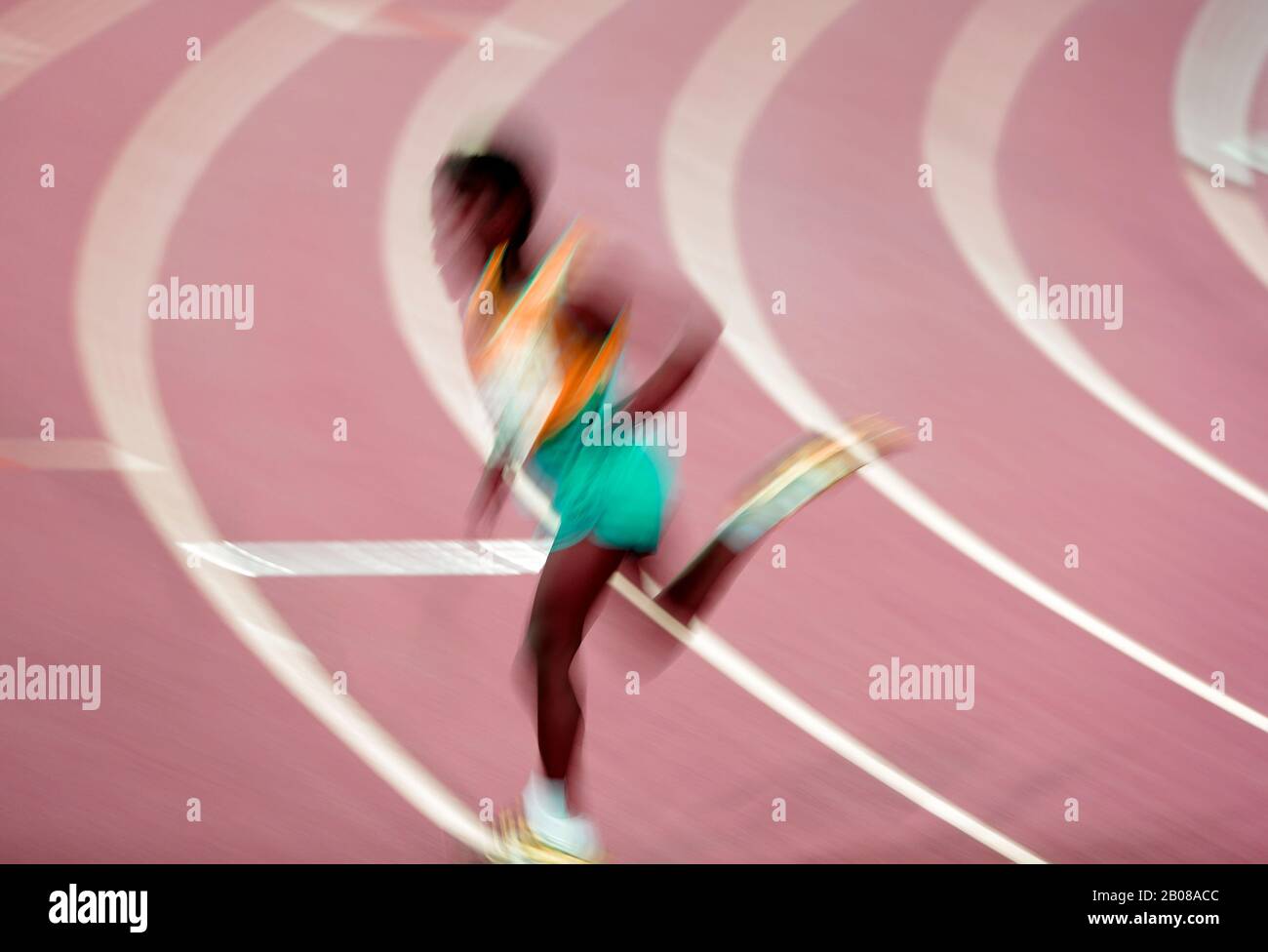 Athlete running on sport stadium blur motion Stock Photo - Alamy