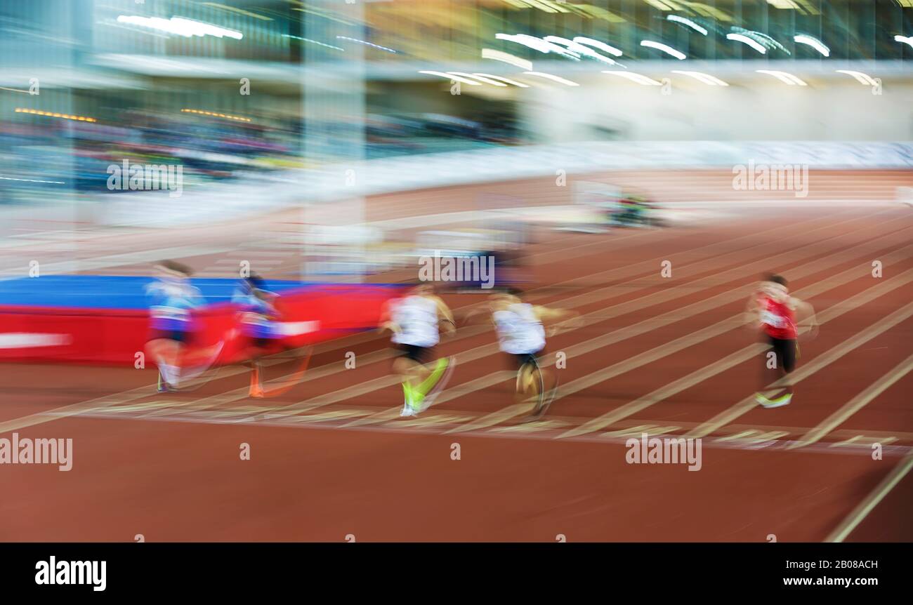 Athletes running on sport stadium, blur motion Stock Photo - Alamy