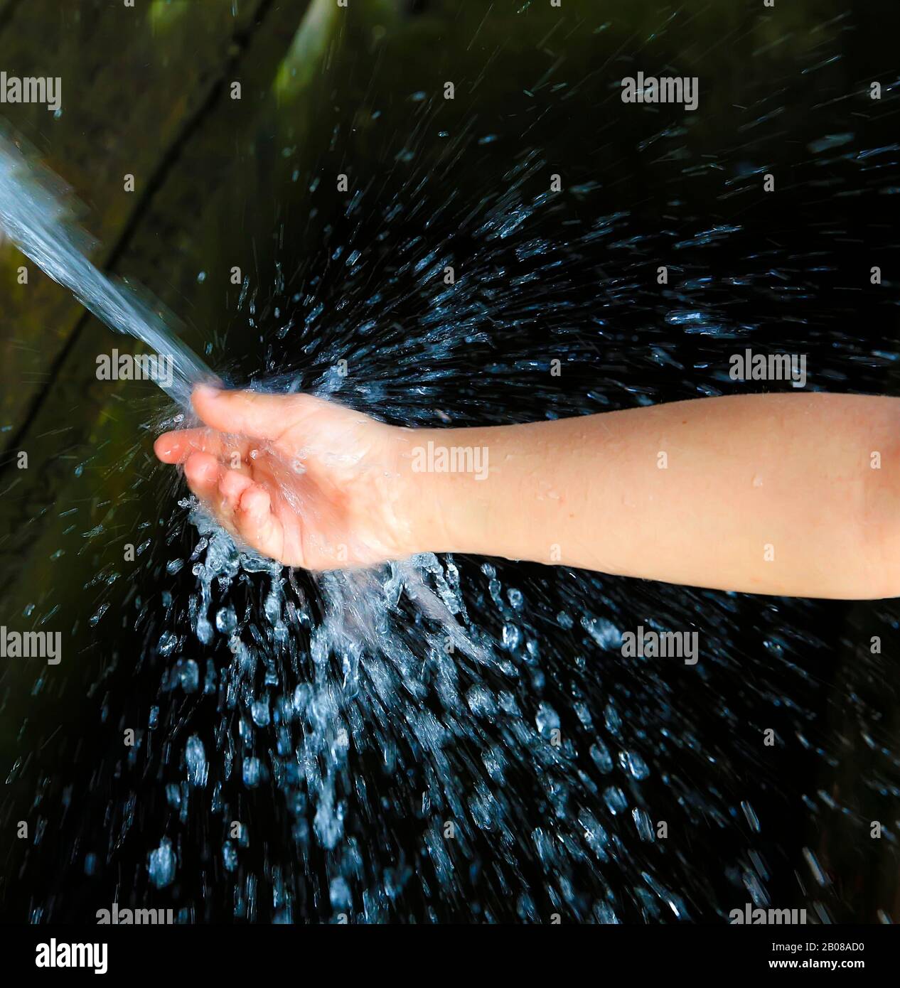 Kid washing hand in fresh, cold, potable water spring Stock Photo - Alamy