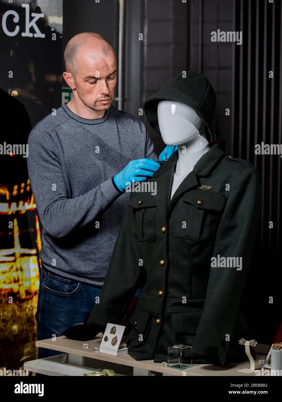 Liam Bradley, curator at Monaghan County Museum, fixing the lapel of a ...