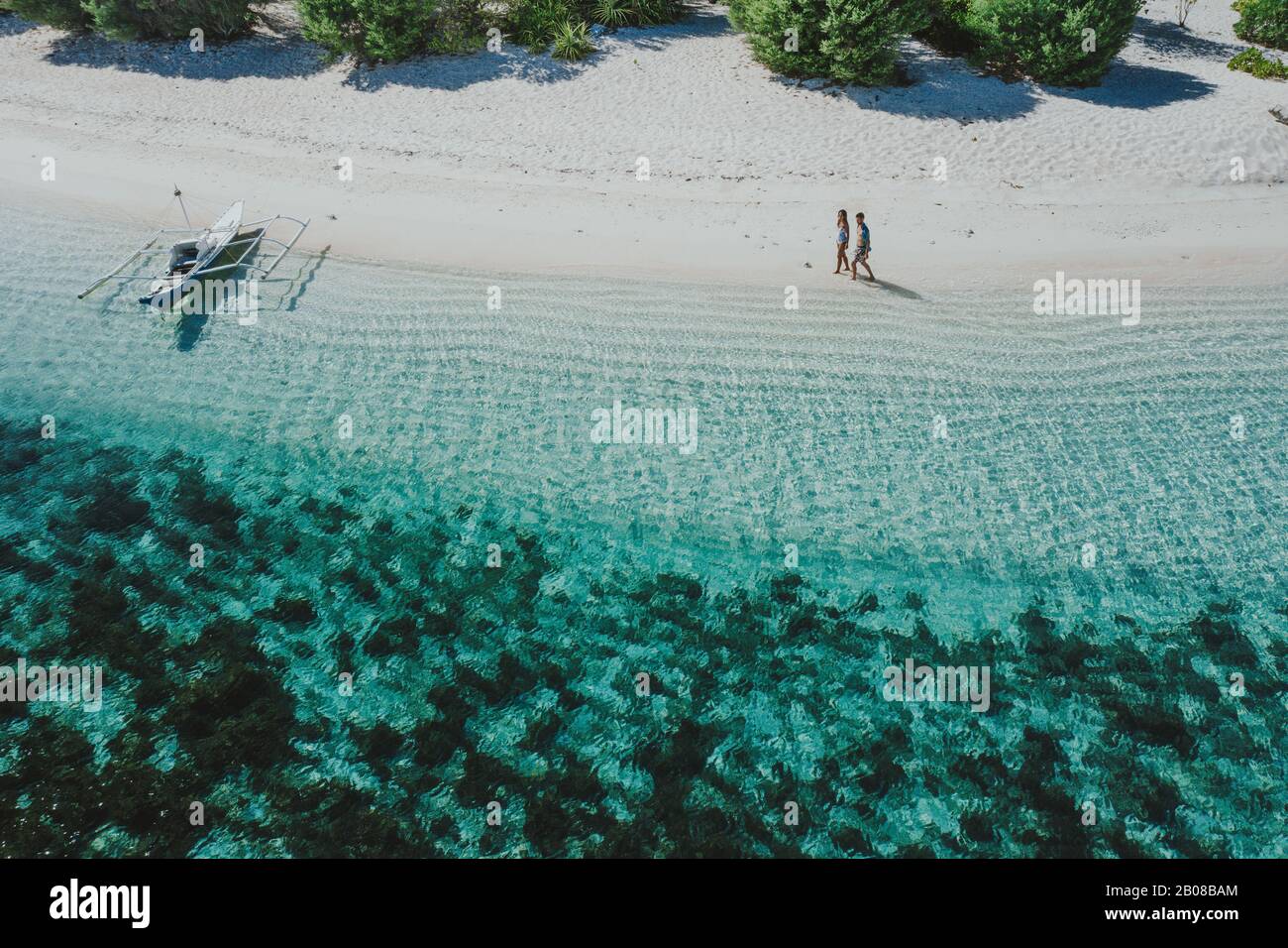 Couple spending time on a beutiful remote tropical island in the ...