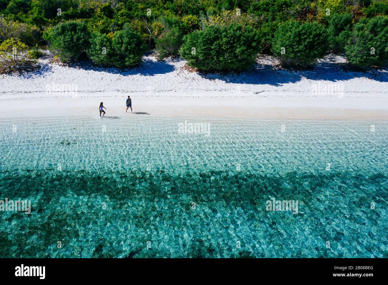 Couple spending time on a beutiful remote tropical island in the ...