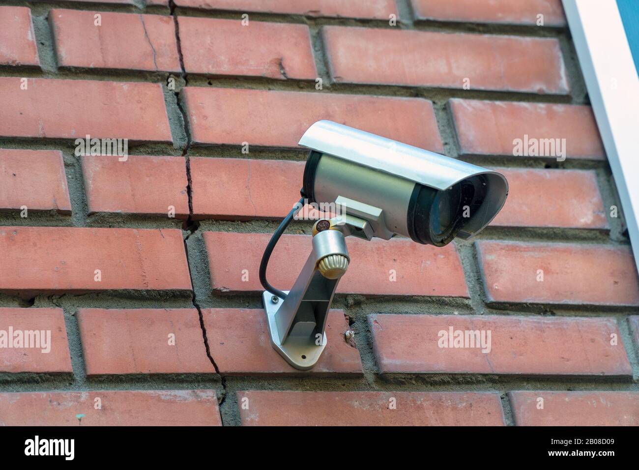 Security camera on the red brick wall hi-res stock photography and ...