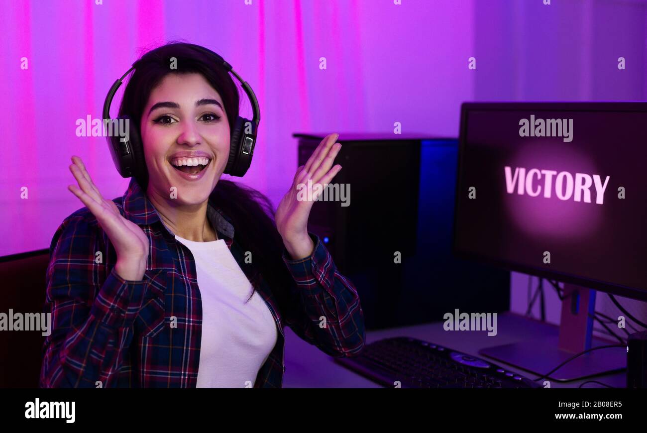 Joyful Female Gamer At Computer Winning Game Celebrating Victory Indoor ...