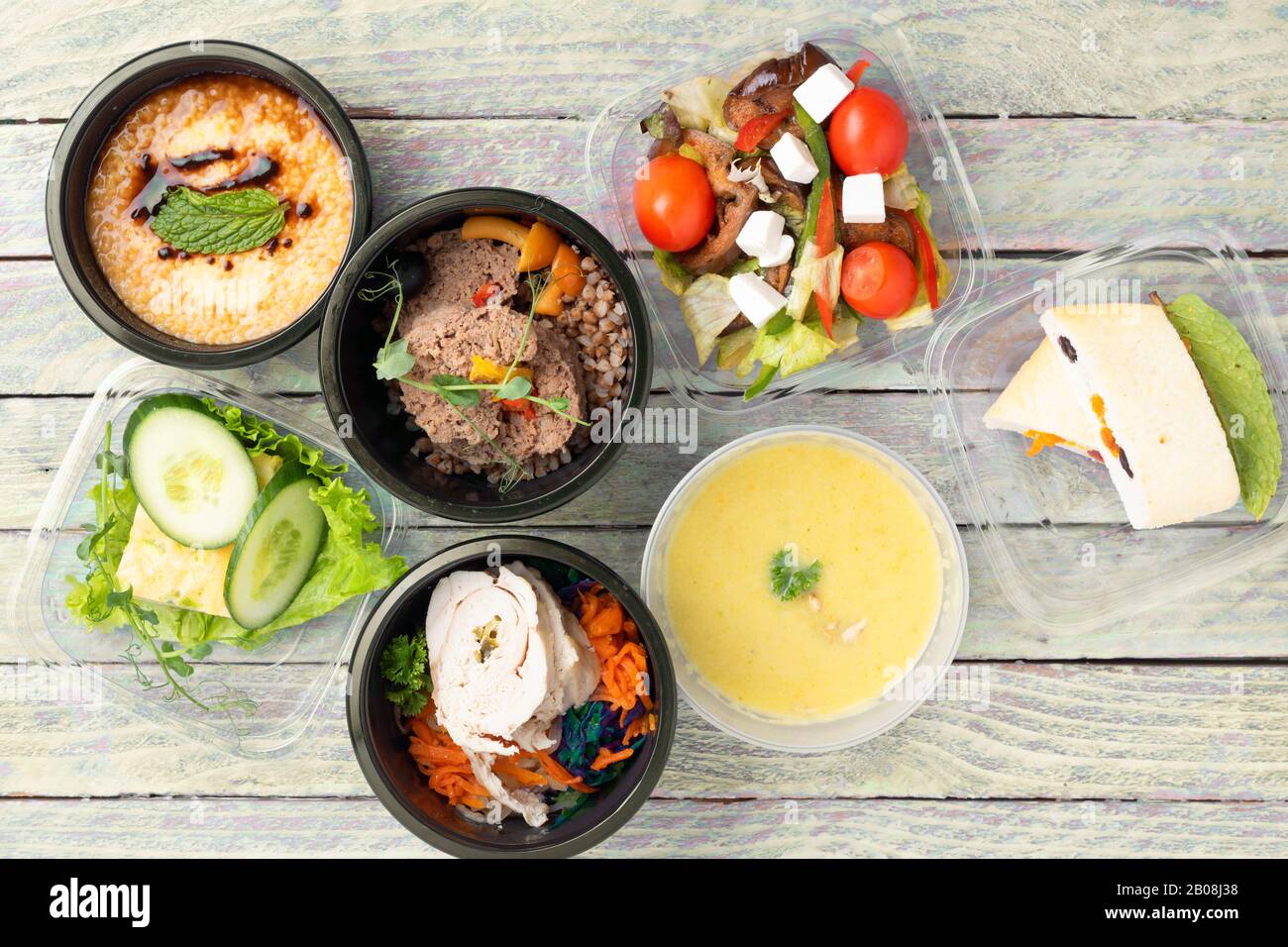 Healthy lunch time at office workplace. Seven healthy meals from take ...