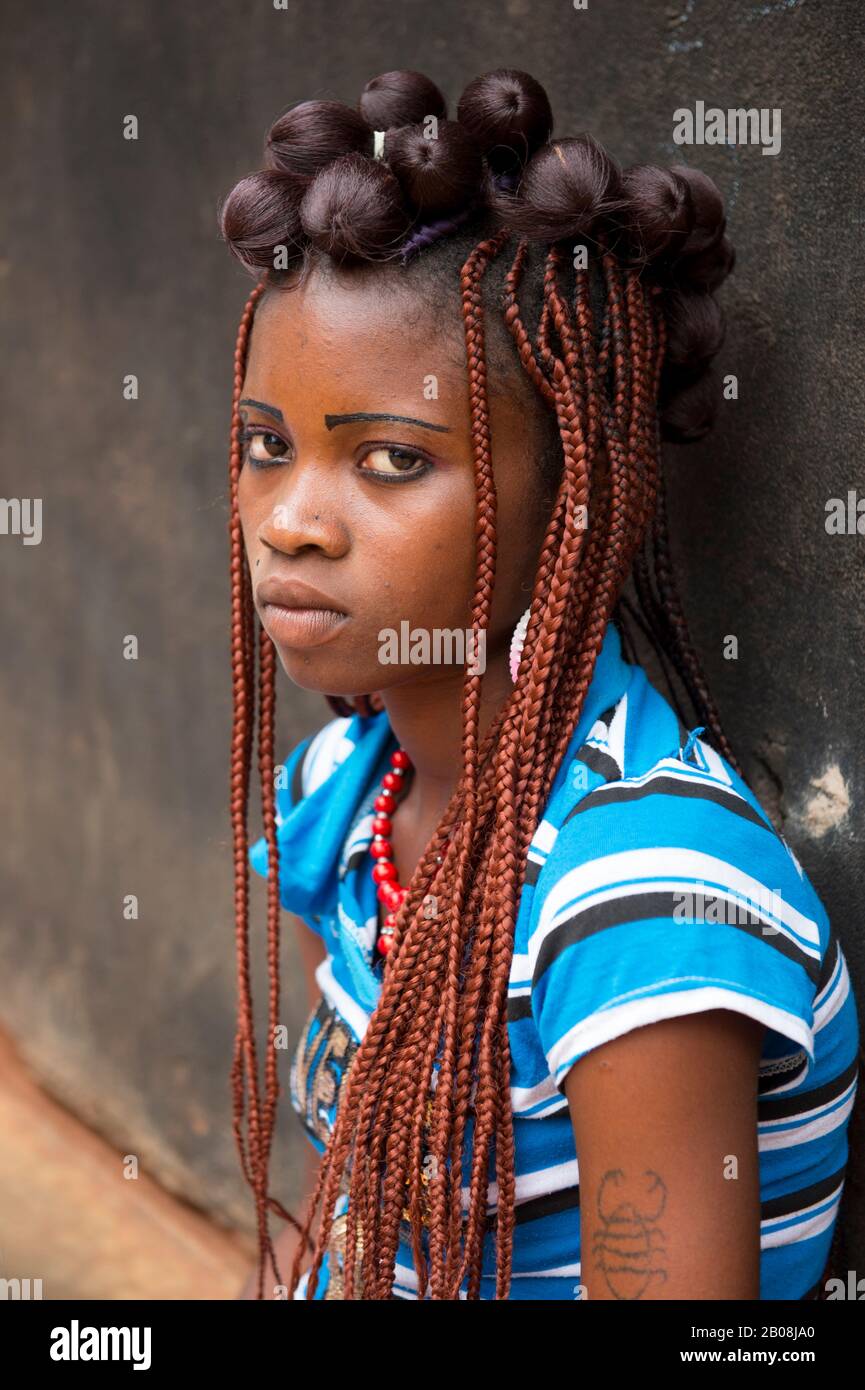 Village scene with portrait of young woman Jeneine in the Akato Viepe ...
