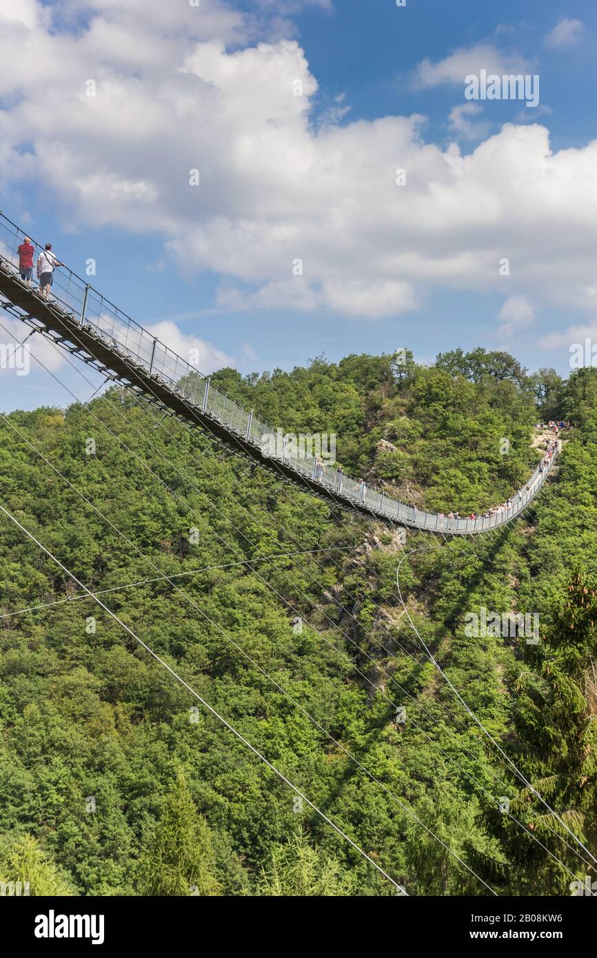 People crossing the Geierlay suspension bridge in Morsdorf, Germany ...