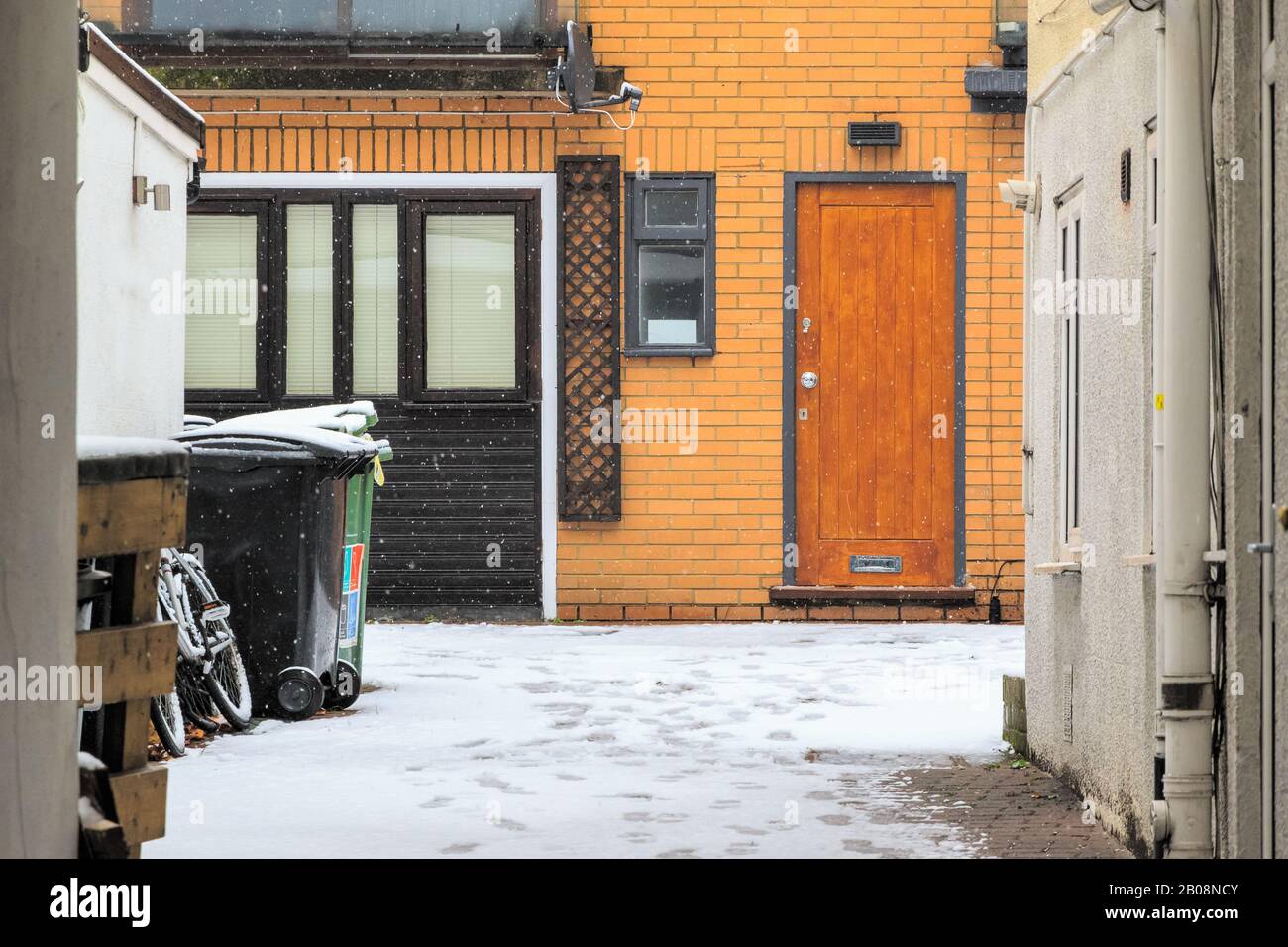 Back lane covered by winter snow around West Hampstead area in London ...