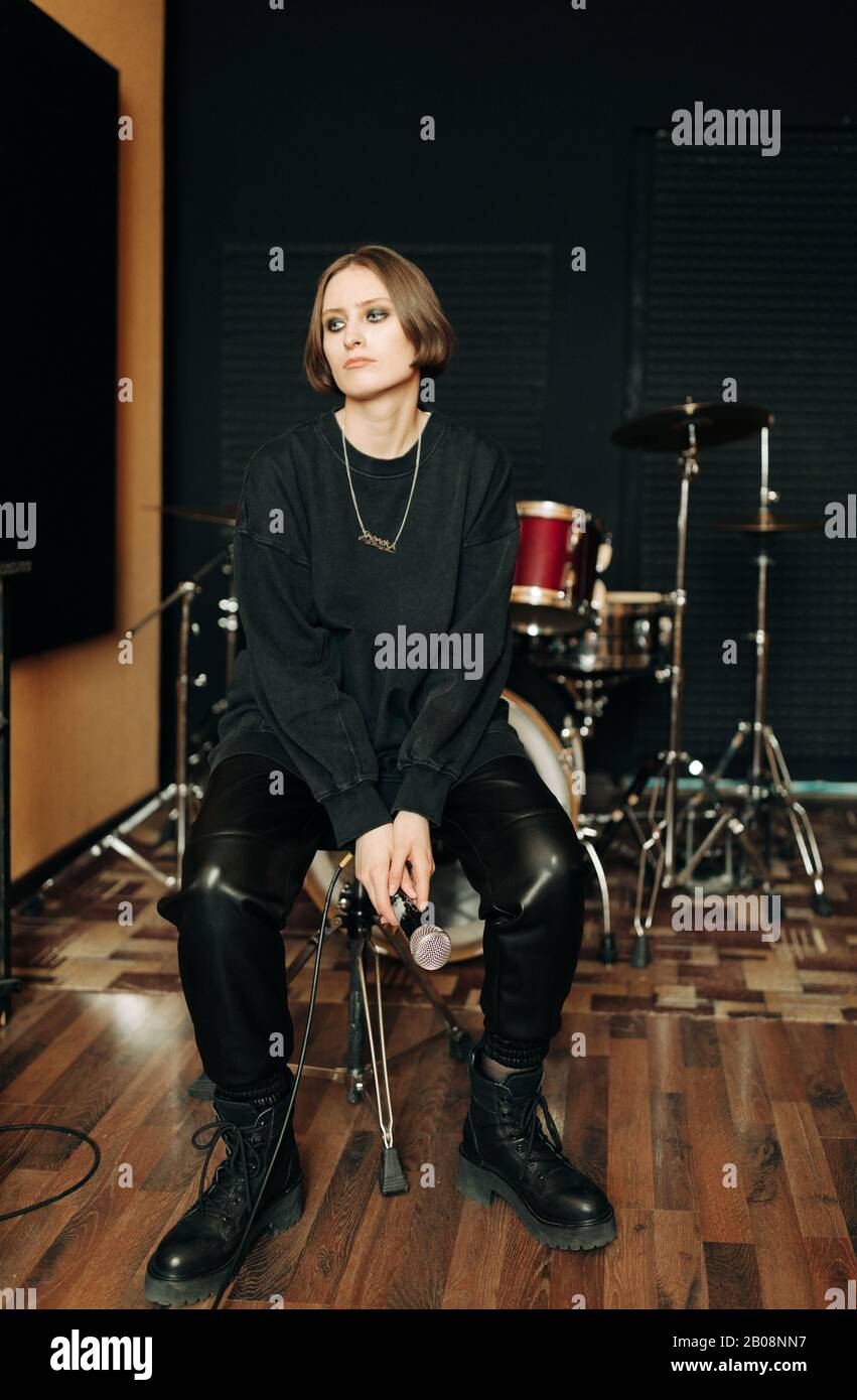 young musician with mic in recording studio Stock Photo - Alamy
