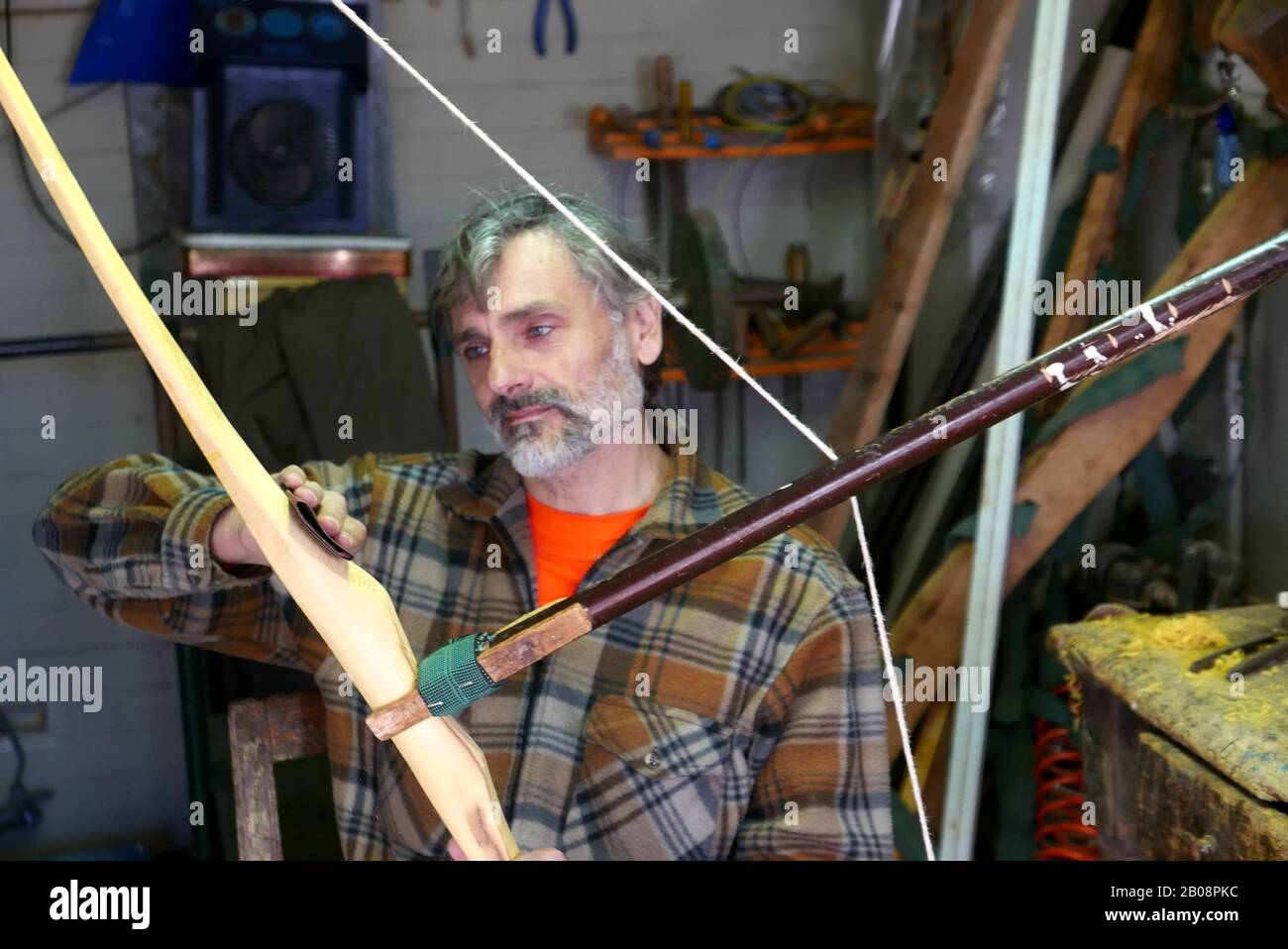 man at work making a traditional bow Stock Photo - Alamy