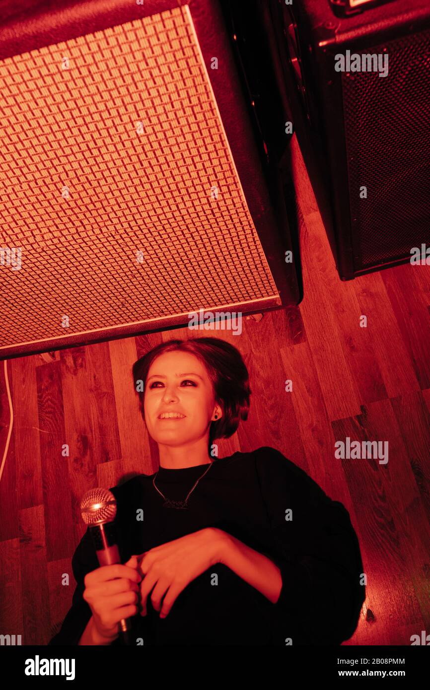 Singer performing in a recording studio Stock Photo - Alamy