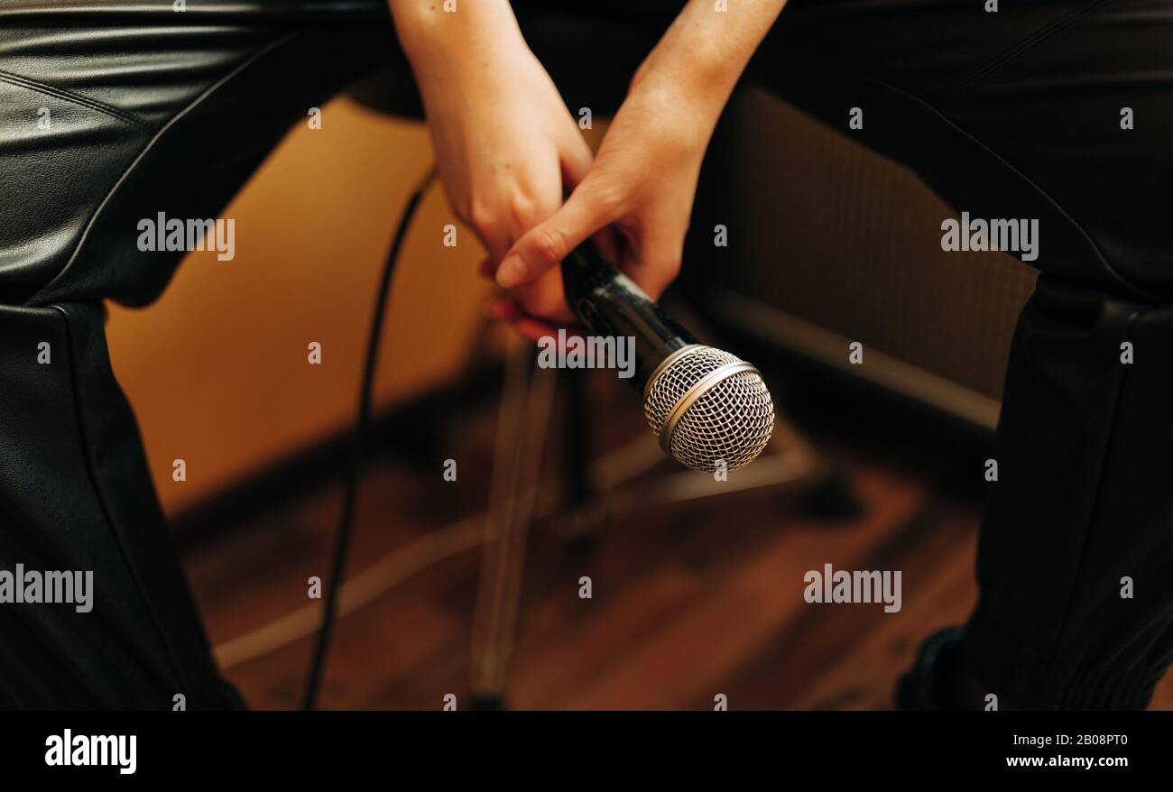 young musician with mic in recording studio Stock Photo - Alamy