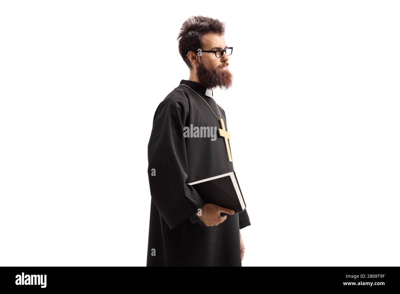 Bearded priest standing and holding the Bible isolated on white ...