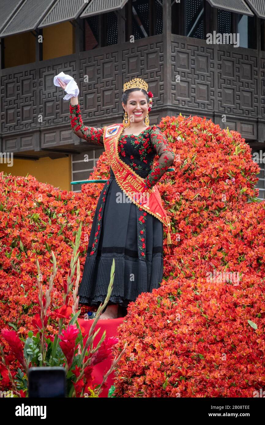 Woman dancer parades in traditional dress on flowery festival float at ...