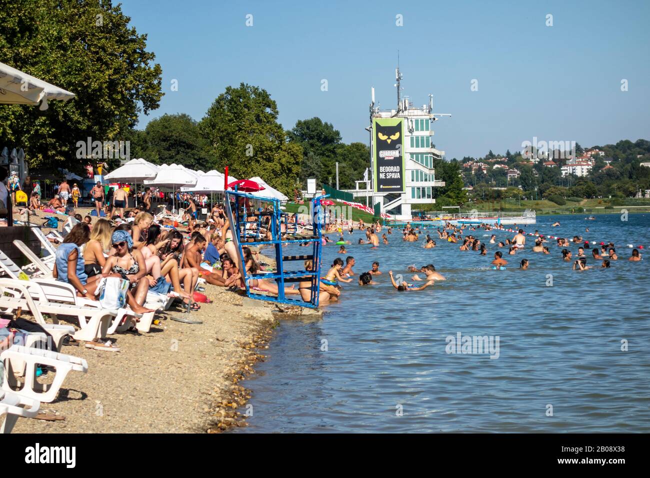 People swimming and sunbathing at Ada Cingalija, the beach of Belgrade ...