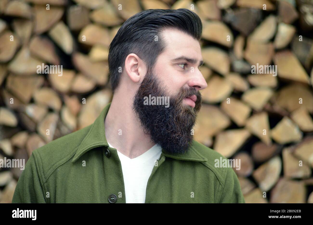 Men with fashionable haircut and beard profile view Stock Photo - Alamy