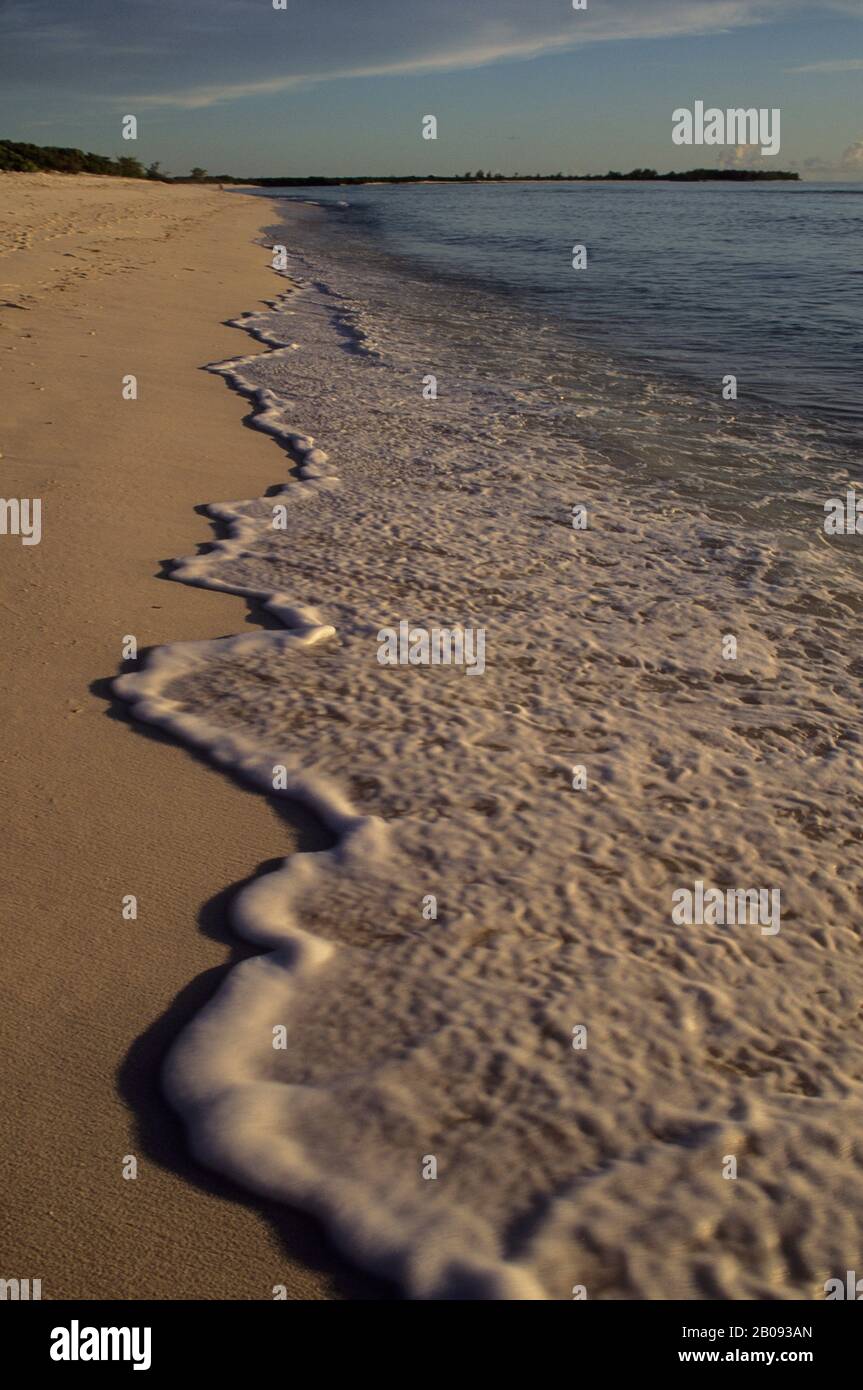 SEYCHELLES, ASSUMPTION ISLAND, SURF ON BEACH Stock Photo - Alamy