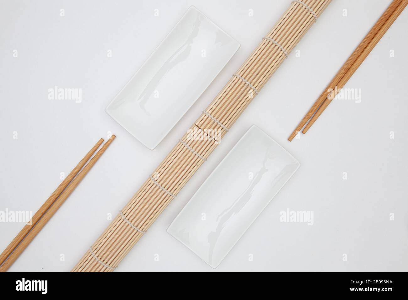 Top View Of White Empty Sushi Plates With Bamboo Chopsticks and Mats ...