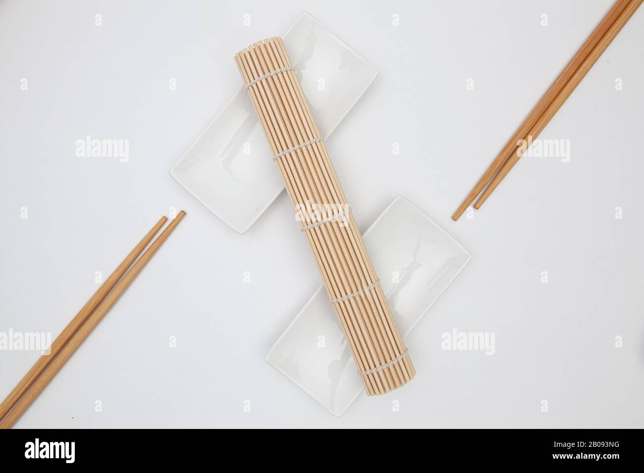 Top View Of White Empty Sushi Plates With Bamboo Chopsticks and Mats ...