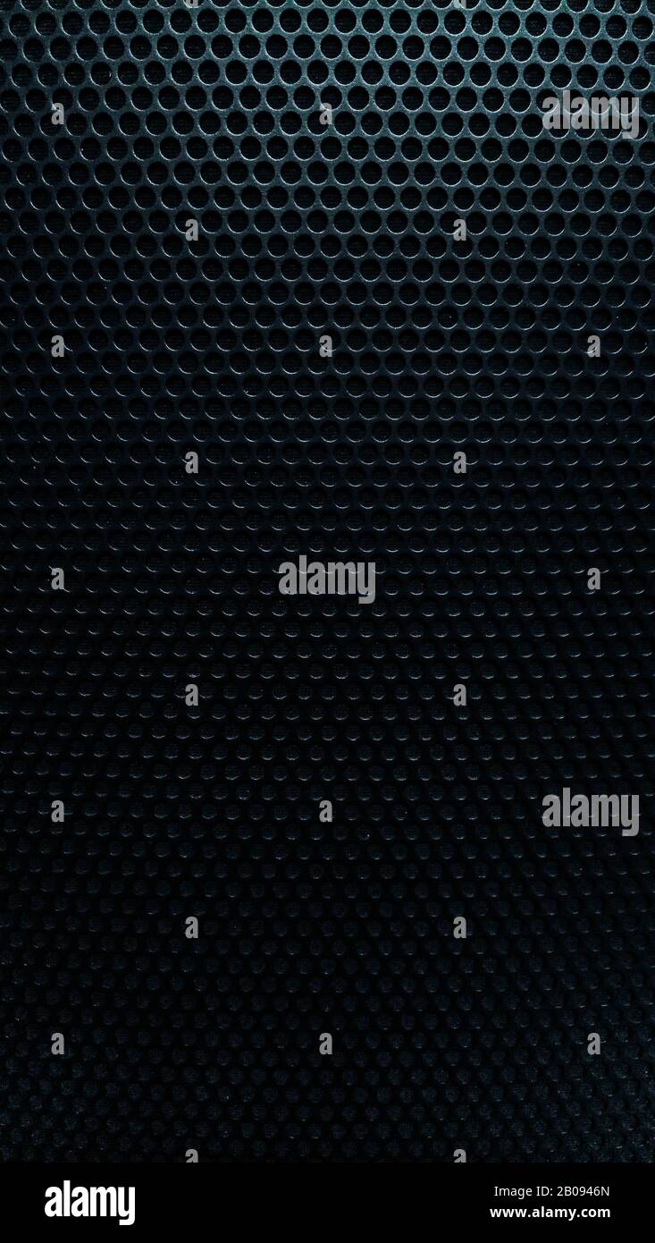 Abstract background metal mesh with even spaced holes in black Stock ...