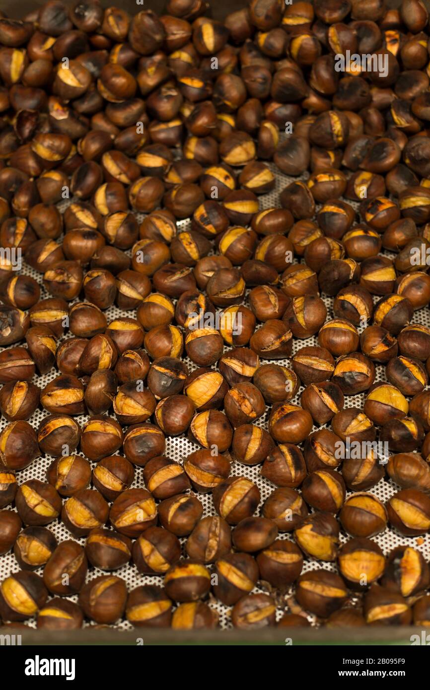 Hot brown roasted chestnuts hi-res stock photography and images - Alamy