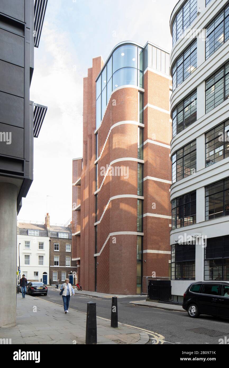 Wide view of curved brick corner. UCLH Eye Hospital, London, United ...