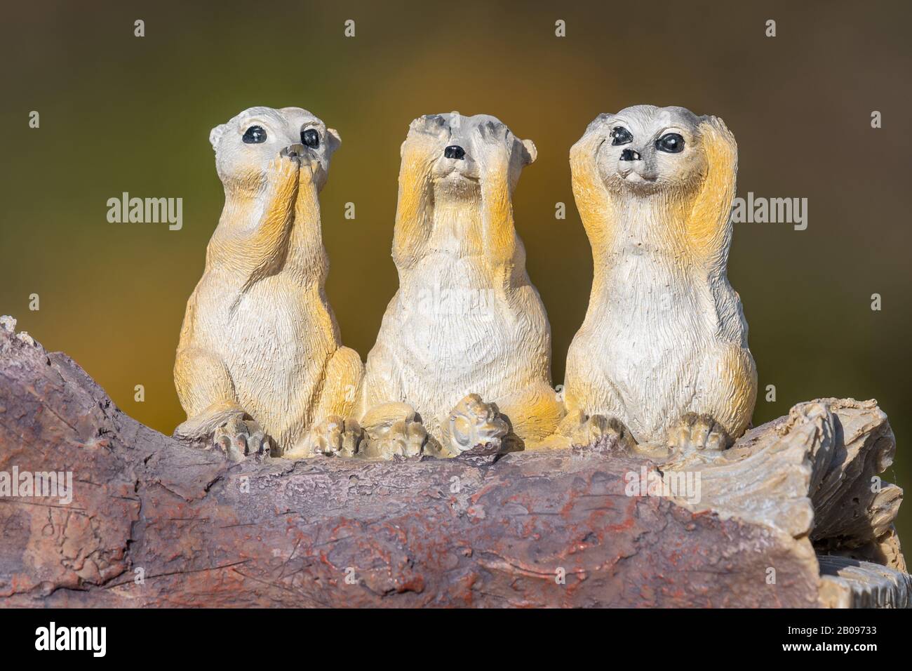 Close up of an ornament of three meerkats depicting the proverb hear no ...