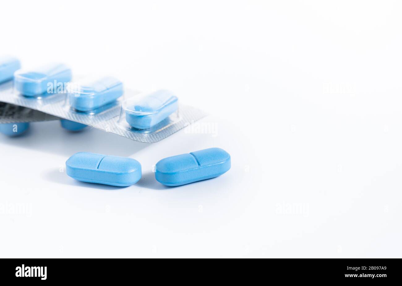 pharmaceutical industry concept, blue pills close-up on a white ...