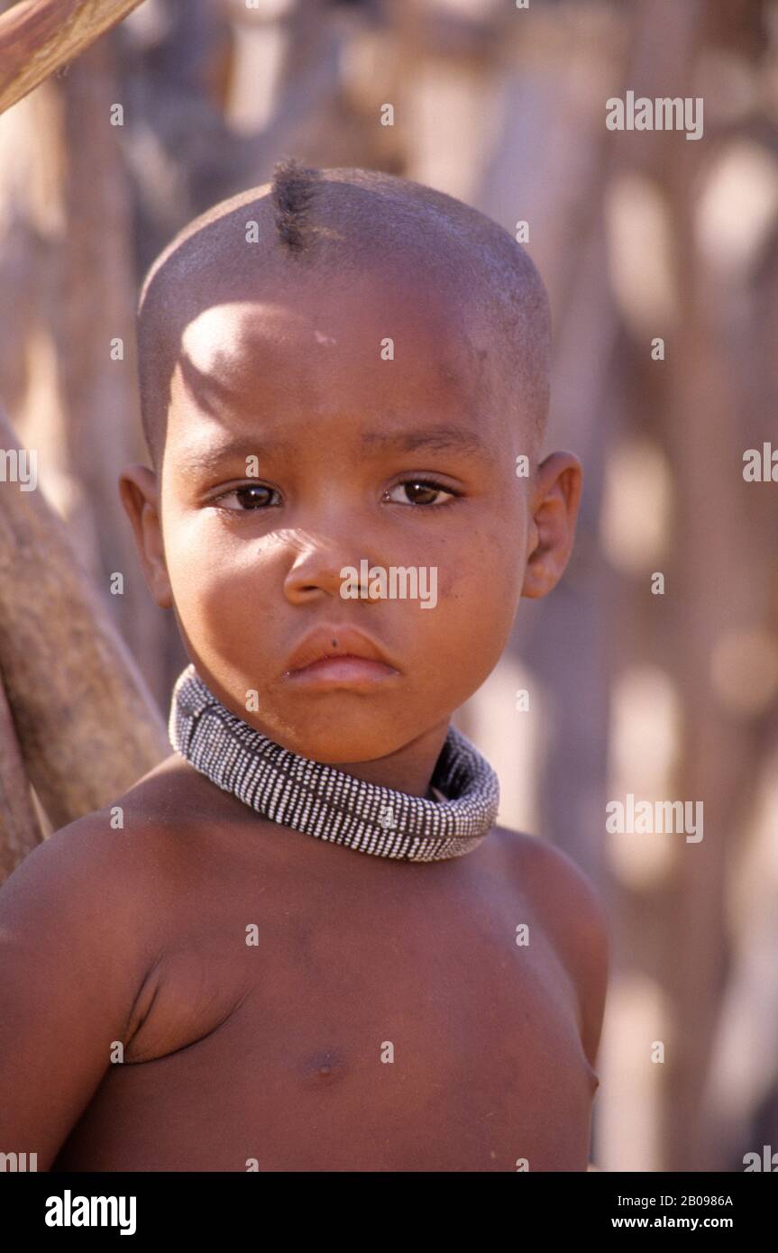 NAMIBIA, SKELETON COAST, HARTMANN VALLEY, NOMADIC HIMBA CAMP, HIMBA BOY ...